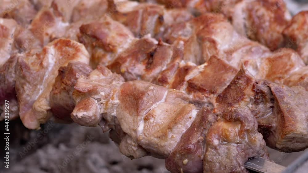 Juicy Crispy Kebab Cooking on a Metal Skewer with Smoke on the Grill ...