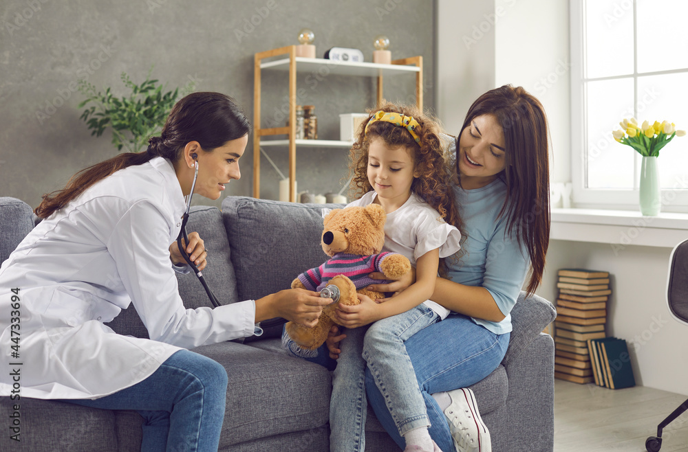 Doctor visiting young patient at home. Pediatrician building contact ...