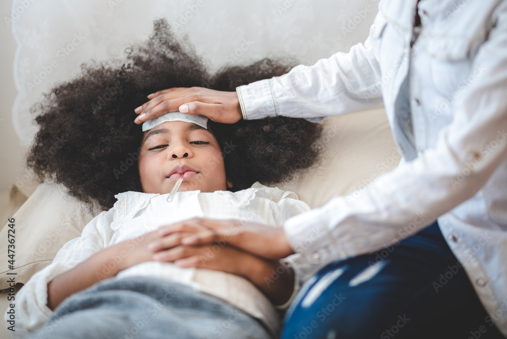 african american children having fever temperature, young girl daughter ...
