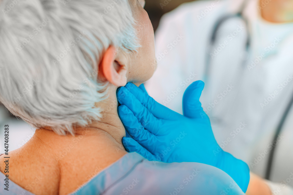 Thyroid Gland Control. Endocrinology Doctor Examining Senior Woman at ...