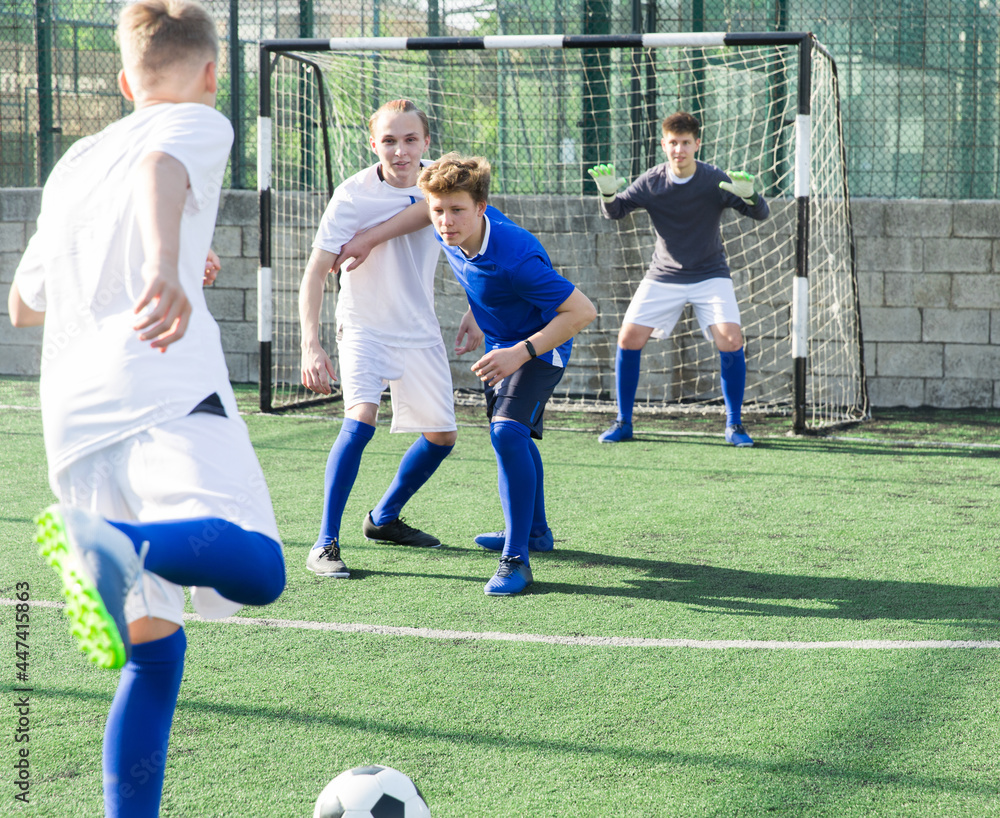Football player swings his leg for kick in direction of goal Stock ...
