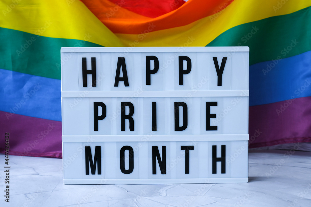 Rainbow flag with lightbox and text HAPPY PRIDE MONTH. Rainbow lgbtq ...