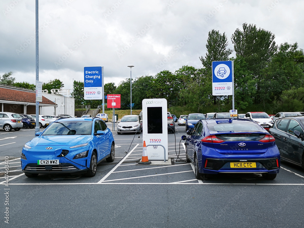 Swansea, UK: April 20, 2021: A Hyundai IONIQ motor car is using a Pod ...