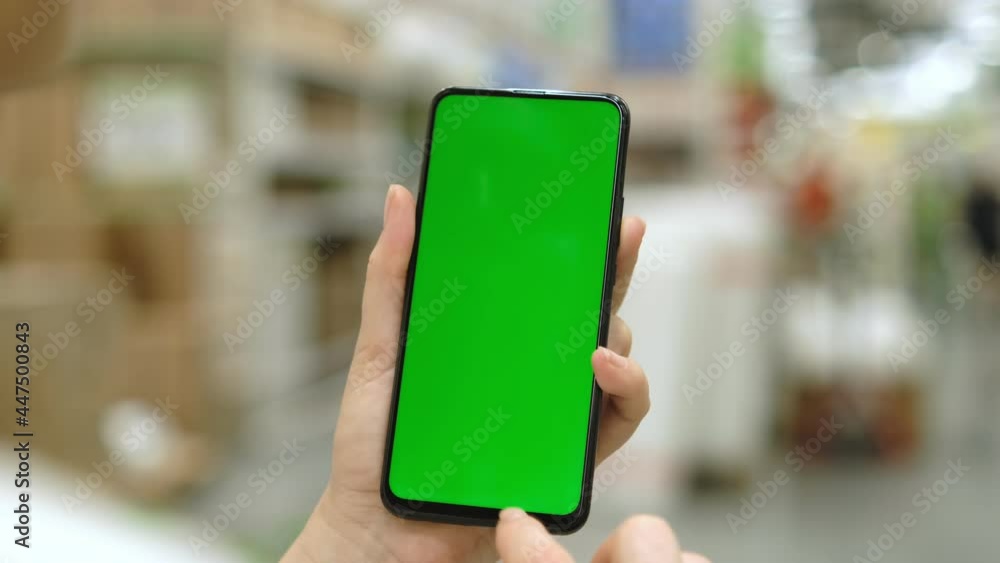 Shopping center. Mall. Department store. Back view of brunette holding ...