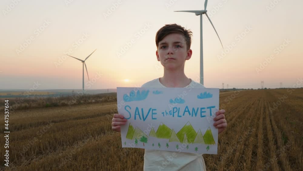 Save the planet poster protest boy holding in front of him on wind ...