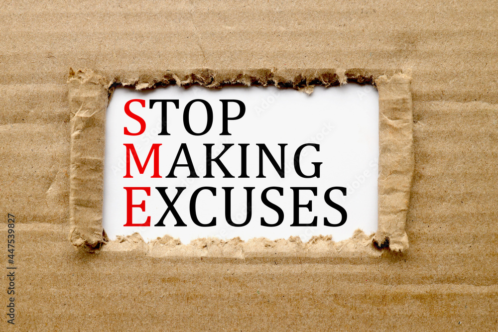 STOP MAKING EXCUSES.STOP MAKING EXCUSES, text on torn paper. test in ...