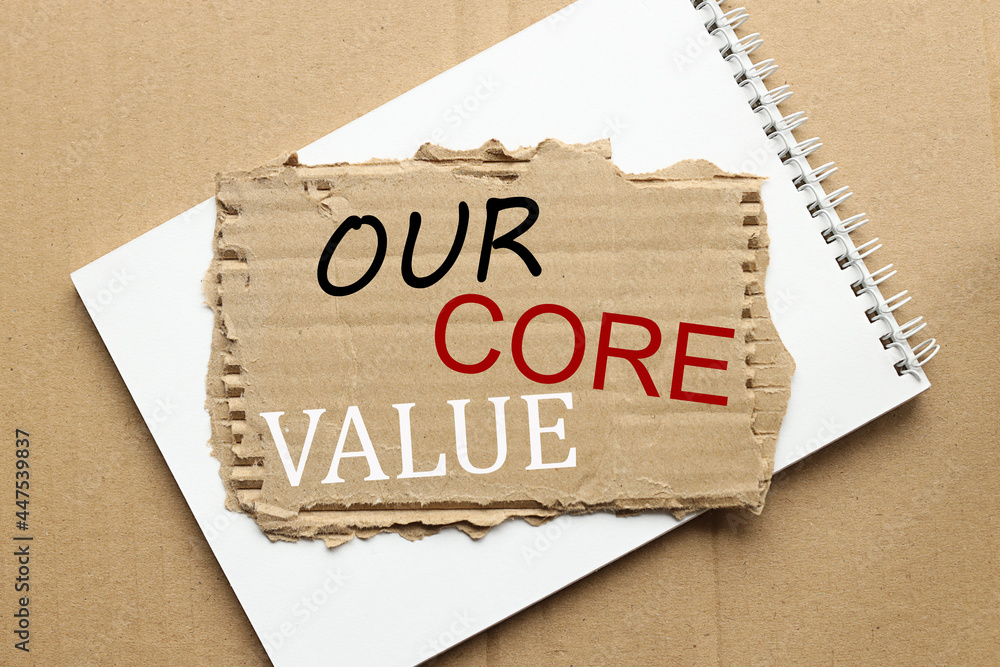 Our Core Values, text on torn cardboard. black letters. on craft ...