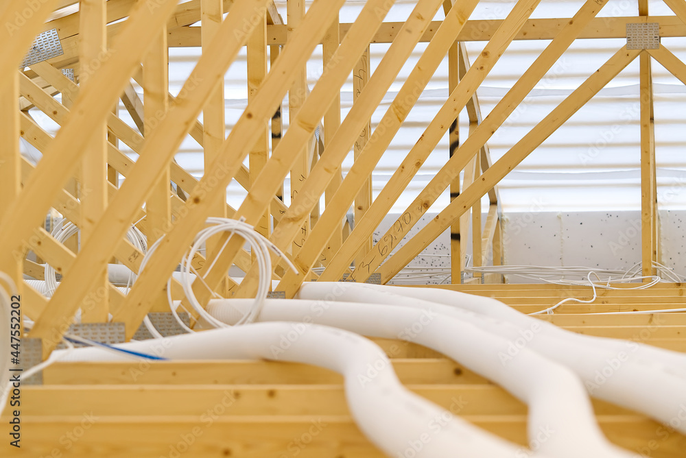Installation of ventilation in a new timber frame house under ...