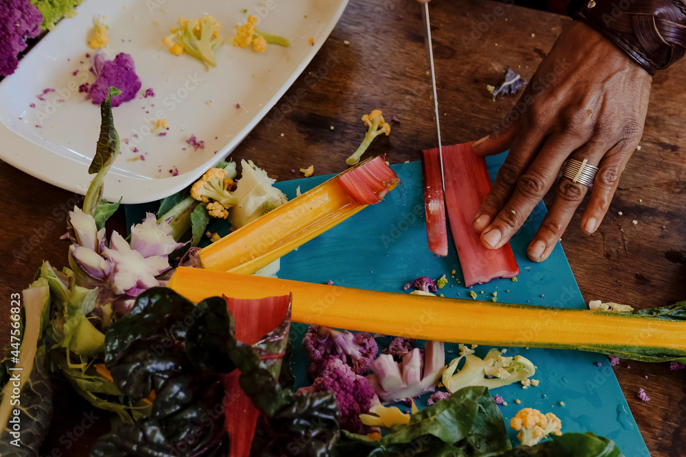 Person cutting vegetables Stock Photo | Adobe Stock