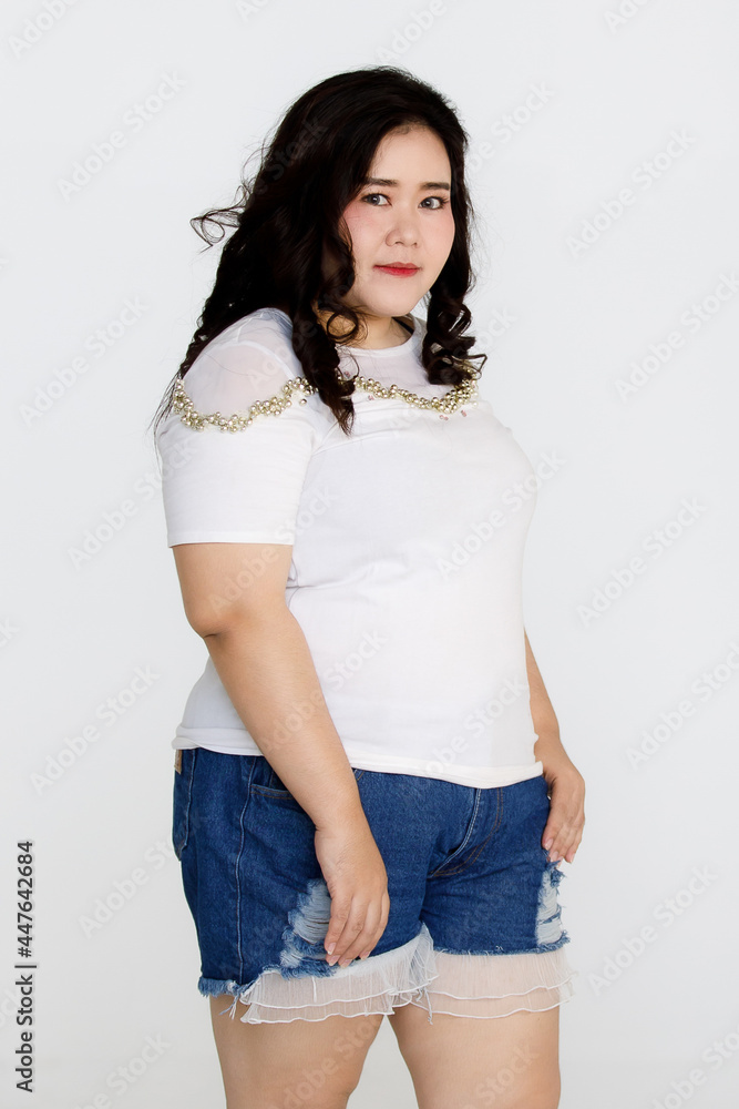 Portrait half body shot of Asian young happy cute friendly overweight fat teen long black hair ...
