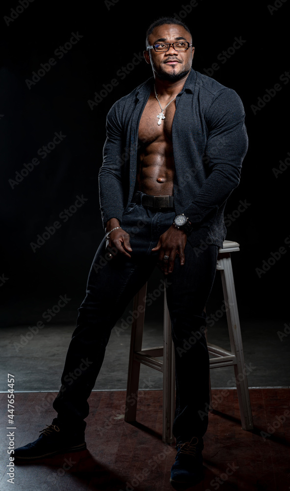Full length view of the african american bodybuilder standing ...