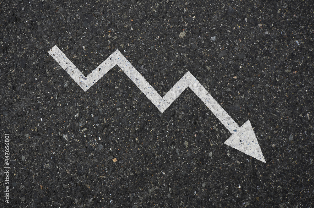 Asphalt with a zigzag arrow sign pointing downwards to the right ...