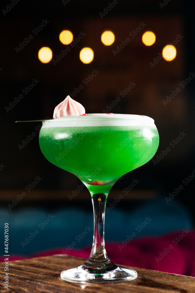 bright alcoholic cocktail of light green color with foam Stock Photo ...