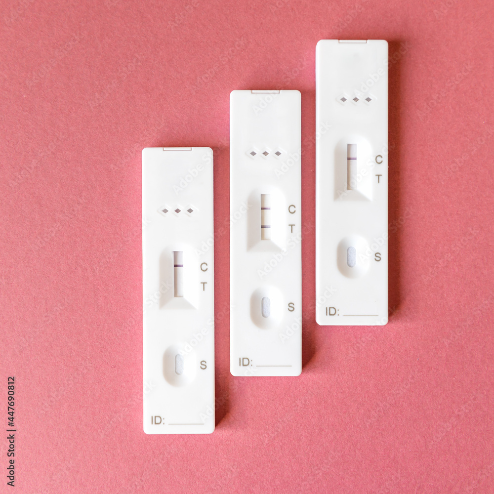 Positive and negative rapid lateral flow COVID 19 tests Stock Photo ...