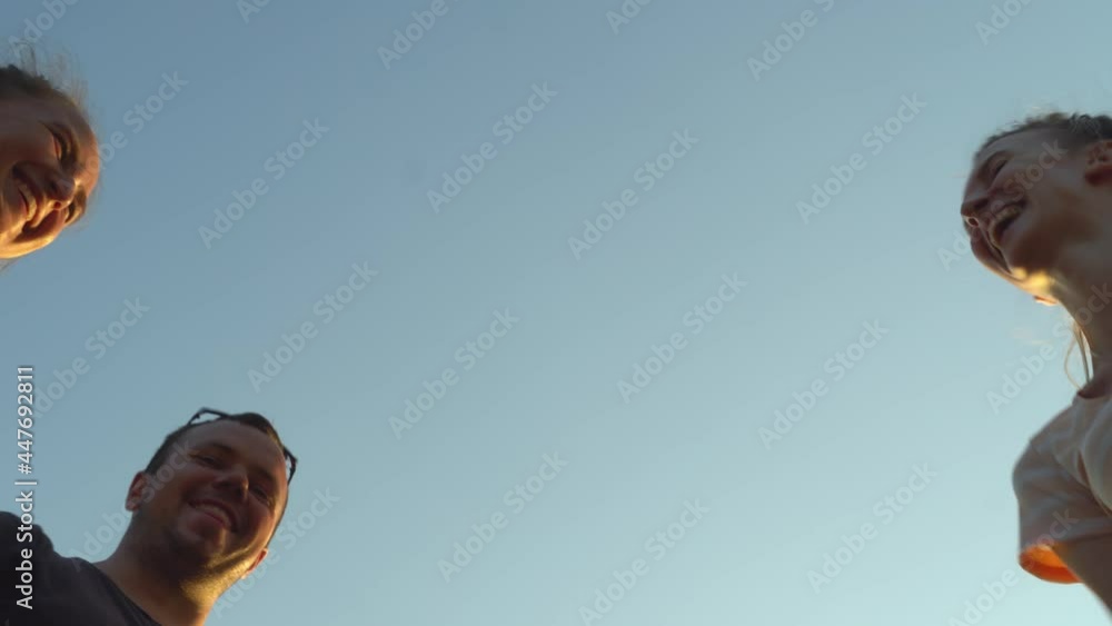 people, guy and three female girls raise their hands to sky, clap each ...