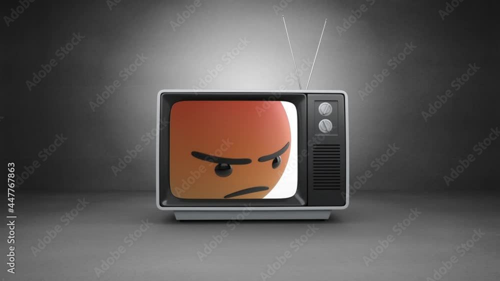 Digital animation of angry face emoji on television screen against grey ...