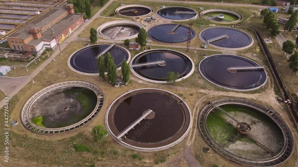 Circular clarifiers located at a massive sewage water cleaning facility ...