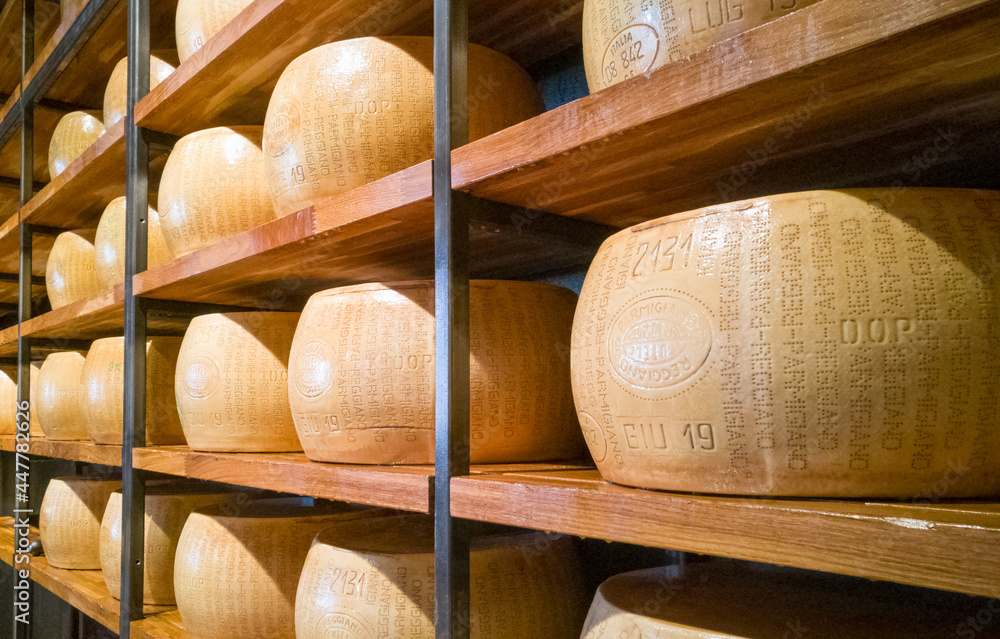 FIDENZA, ITALY - CIRCA JULY 2021: Parmigiano Reggiano cheese warehouse ...