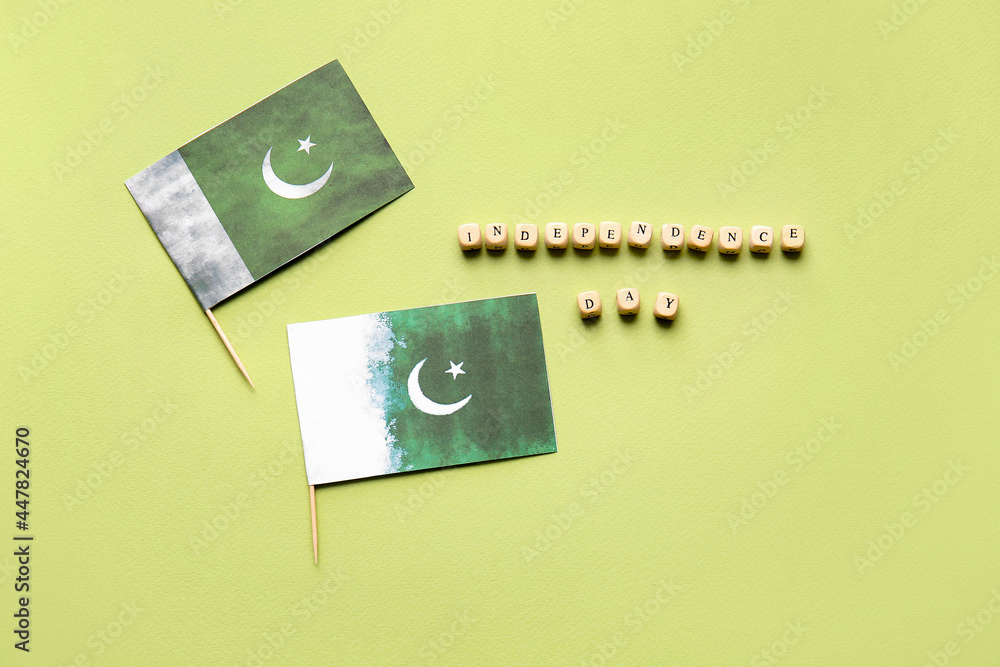 Flags of Pakistan and text INDEPENDENCE DAY on color background Stock ...