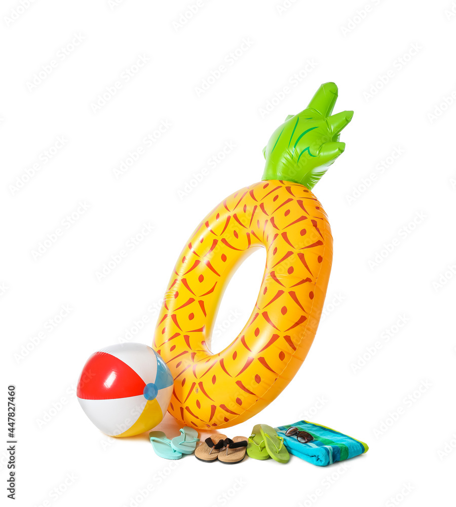 Inflatable ring and beach accessories on white background Stock Photo ...