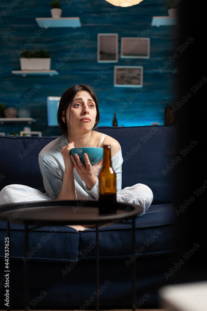 Depressed woman watching drama movie on tv crying having emotional ...
