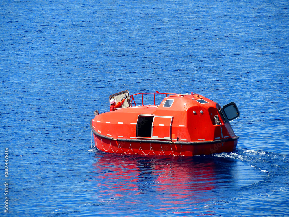Offshore Life boat or survival craft at muster station of oil and gas ...