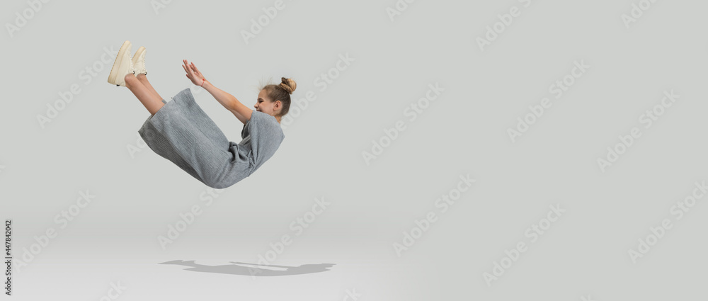 Studio shot of little preschool caucasian girl in casual clothes ...