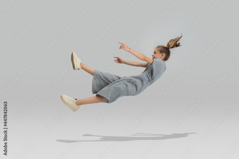 Studio shot of little preschool caucasian girl in casual clothes ...