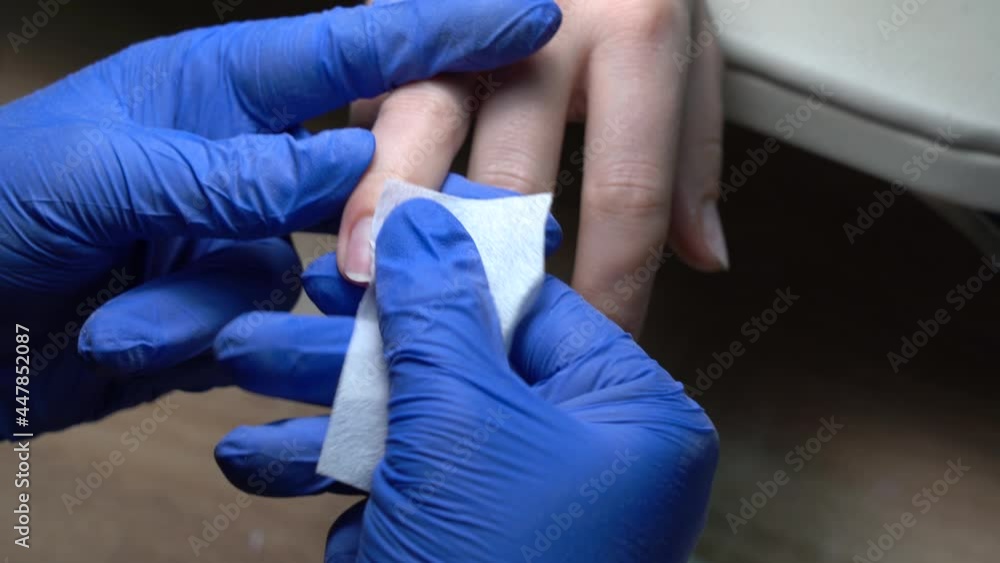 Process of removing skin cuticle of finger nails of female client in ...