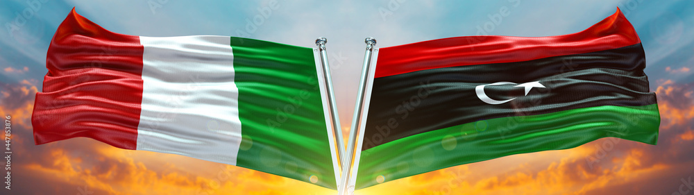 Italy Flag and Libya flag waving with texture sky Cloud and sunset ...
