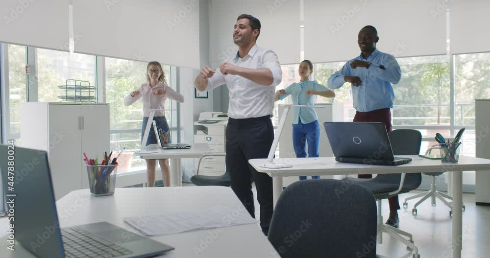 Group of happy young diverse businesspeople doing stretching exercise in office Stock Video ...