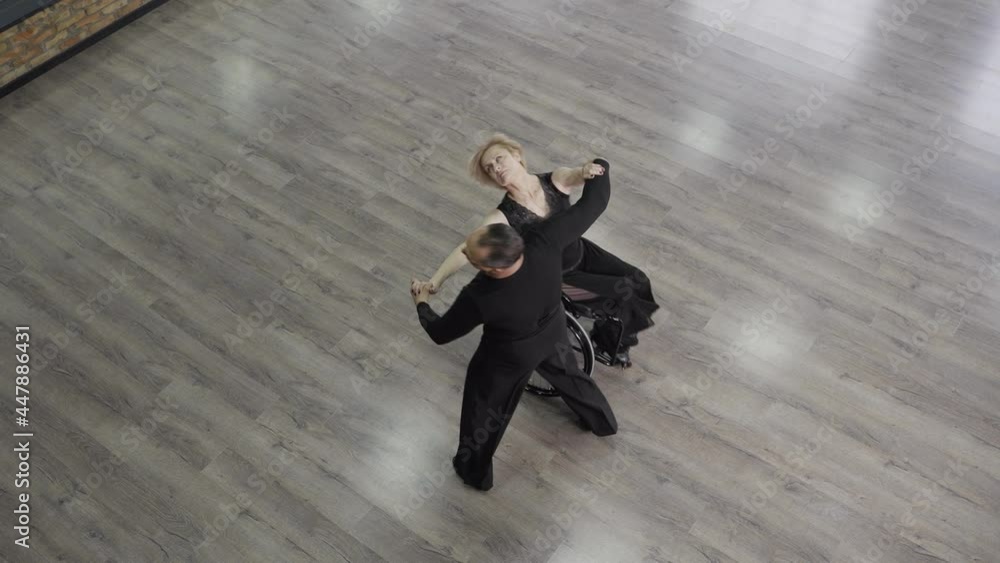 Top view of graceful middle aged ball dancers, disabled blonde woman on ...