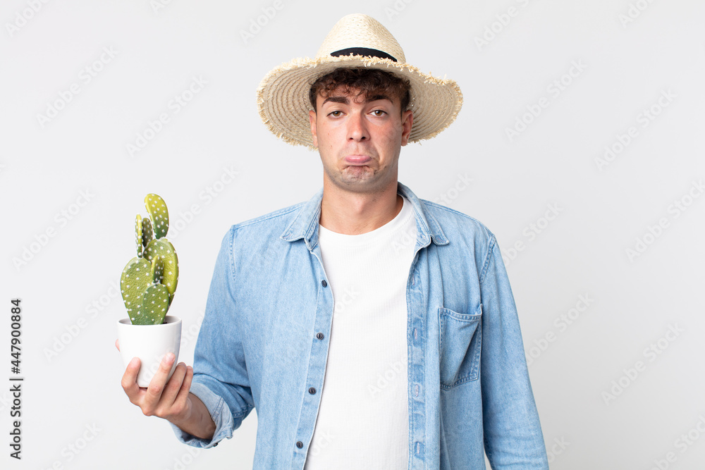 young handsome man feeling sad and whiney with an unhappy look and ...