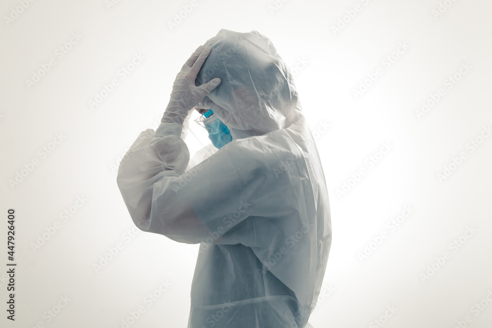 Crying volunteer during COVID-19 in serious pandemic crisis. Healthcare ...