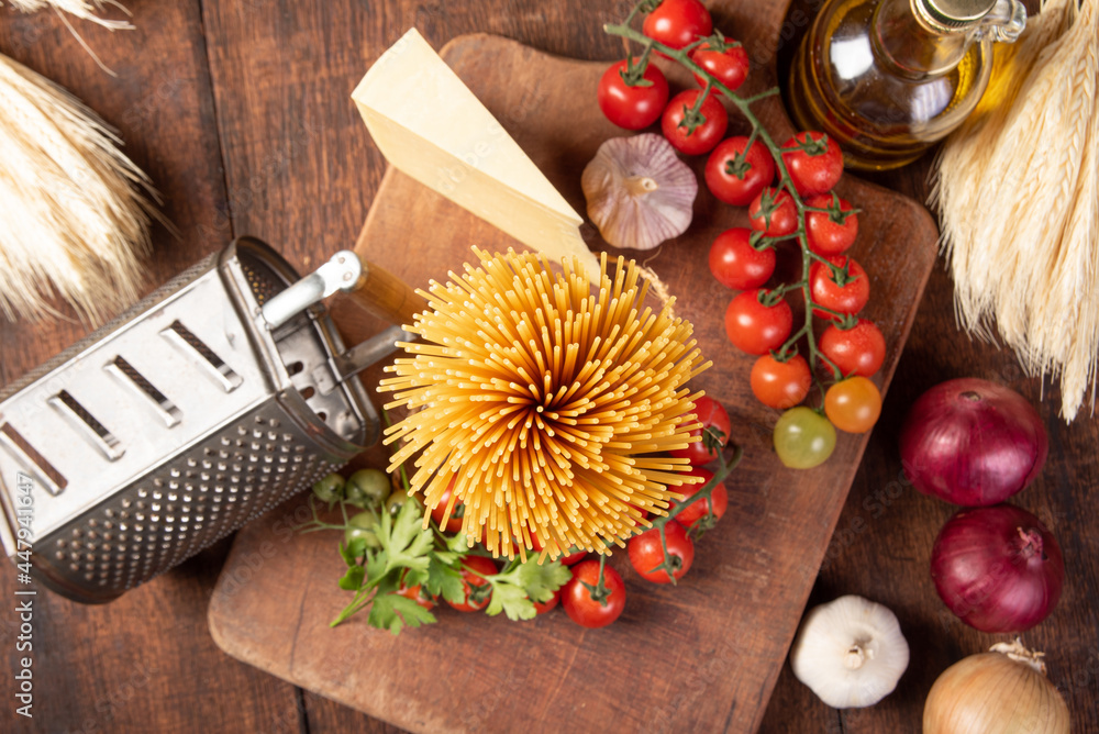 Italian pasta (macaroni), spaghetti tied with sisal string, tomatoes ...