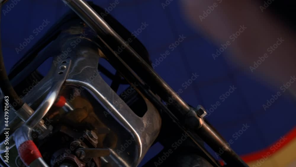 Here you can see a detail shot of a hot air balloon being inflated with ...