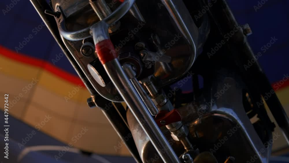 Here you can see a detail shot of a hot air balloon being inflated with ...