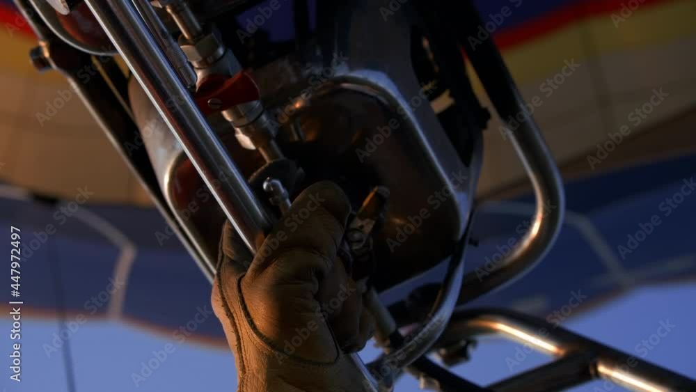 Here you can see a detail shot of a hot air balloon being inflated with ...