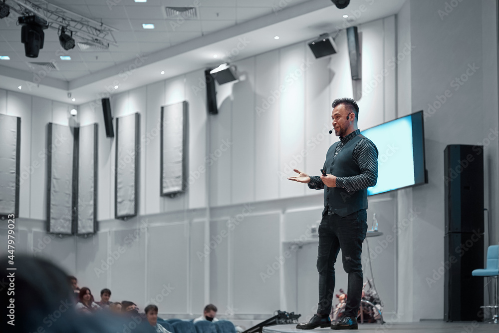 speaker giving a lecture on stage in the conference hall. Stock Photo ...