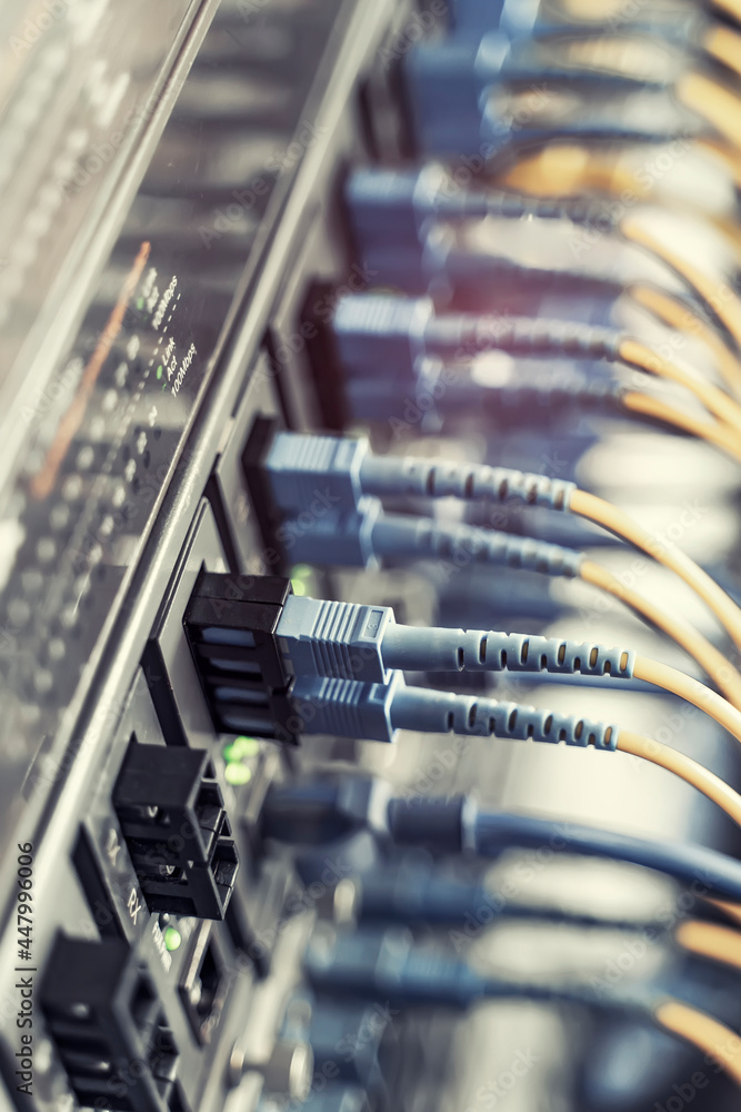 Fiber Optic cables connected to optic ports and UTP, Network cables ...