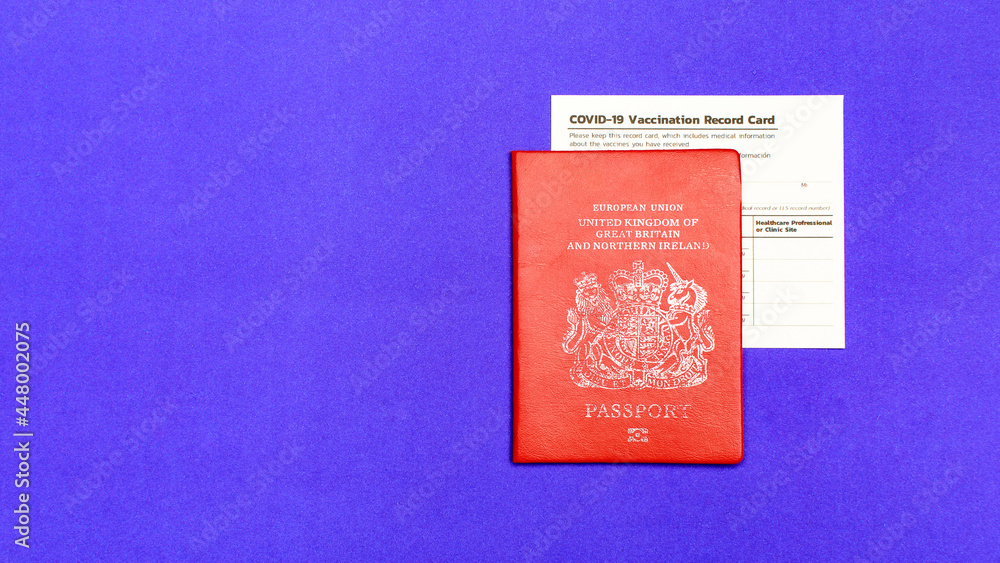 Covid-19 vaccination record card and white hygiene face mask for virus ...
