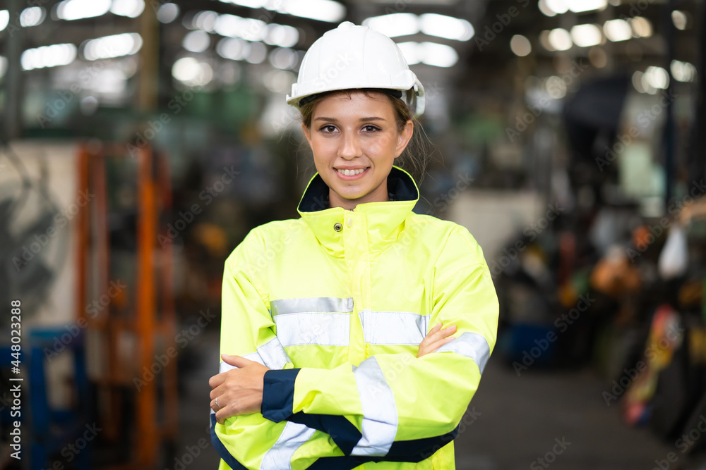 Caucasian engineer Woman worker at Metal lathe industrial manufacturing ...