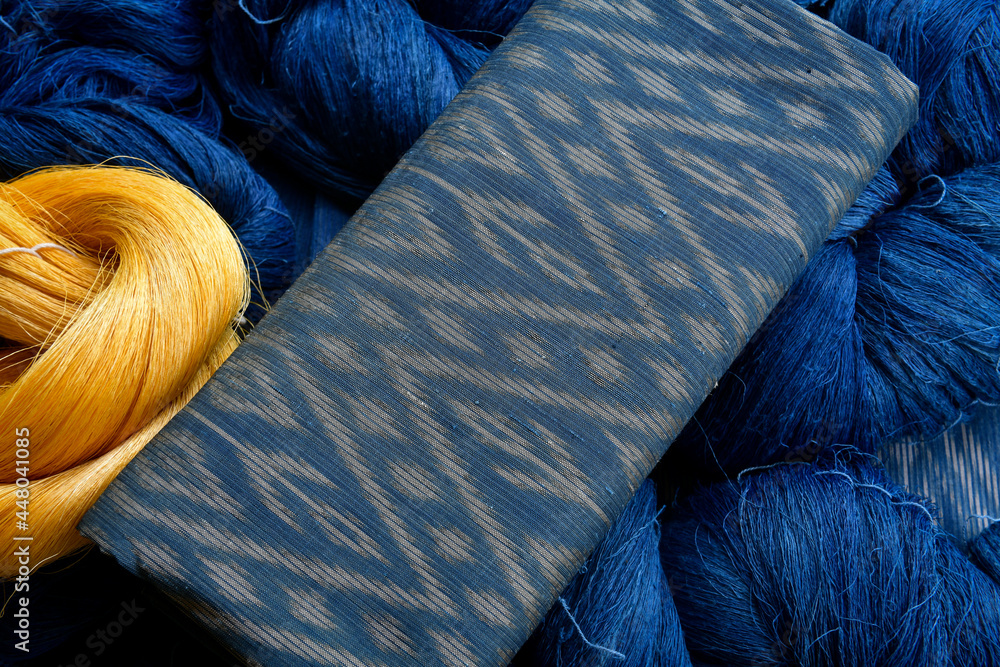 Crafts and craftsmanship. Traditional Isan Thai silk indigo weaving ...