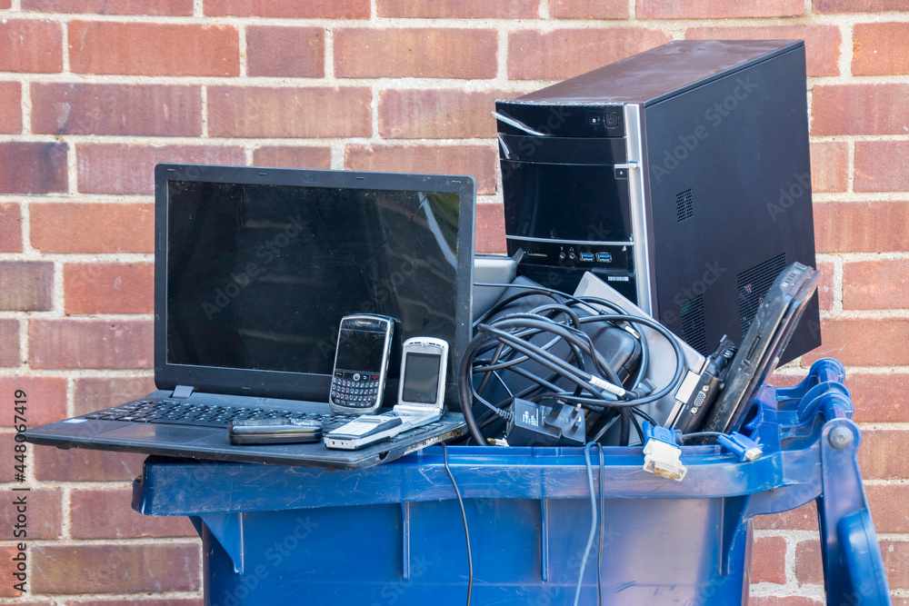 Old hardware put into a recycling container. Stock Photo | Adobe Stock
