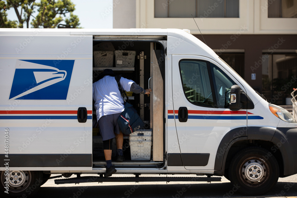Fullerton, California, USA - July 6, 2021: A USPS Postal worker ...