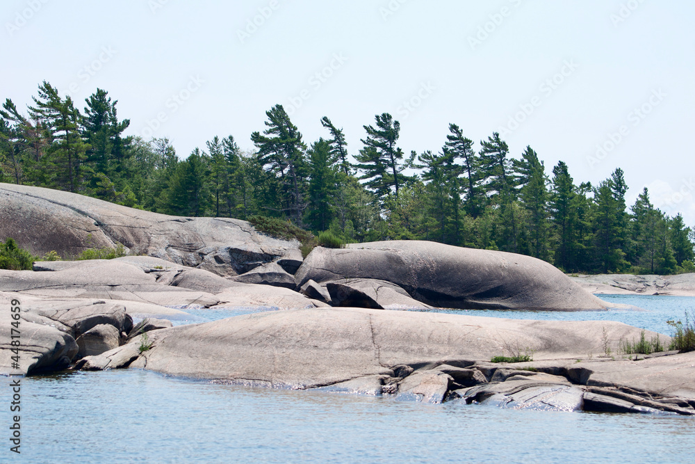 Smooth granite rocks and windswept pines in Indian Harbour Georgian Bay ...