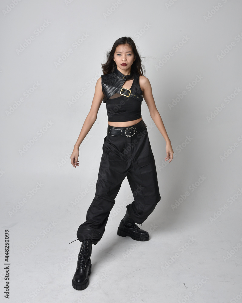 Full length portrait of pretty young asian girl wearing black tank top ...