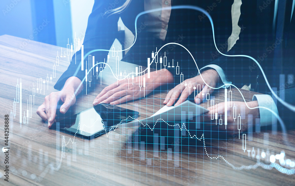 Businessman and businesswoman traders working together to develop new ...