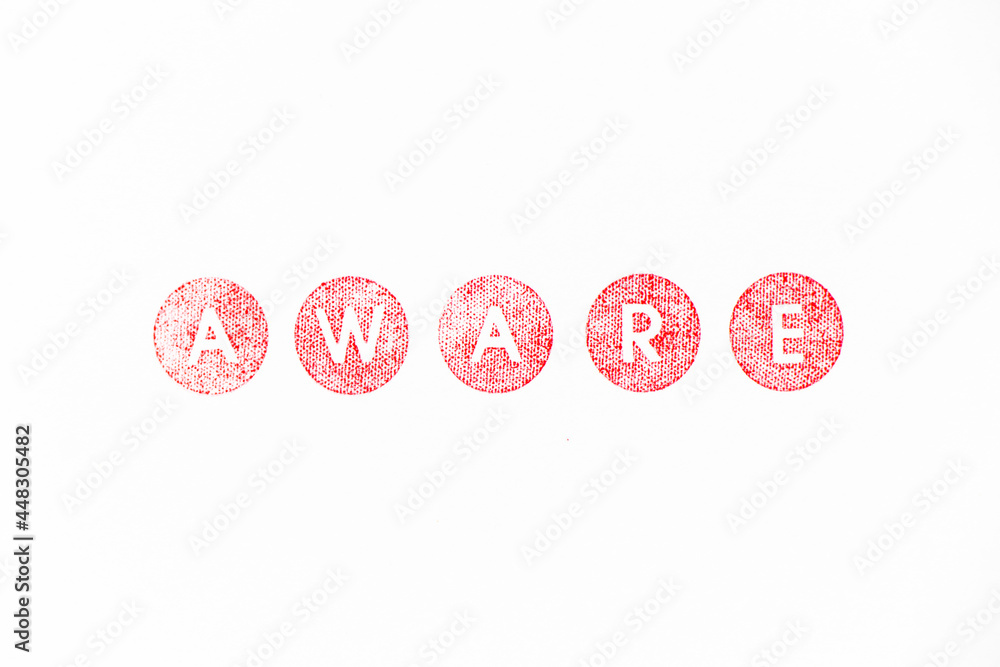 Red color rubber stamp in word aware on white paper background Stock ...