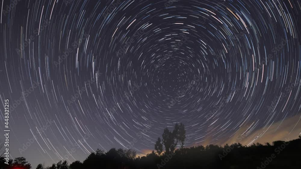Stars form star trails, the time lapse clip shows the star paths ...
